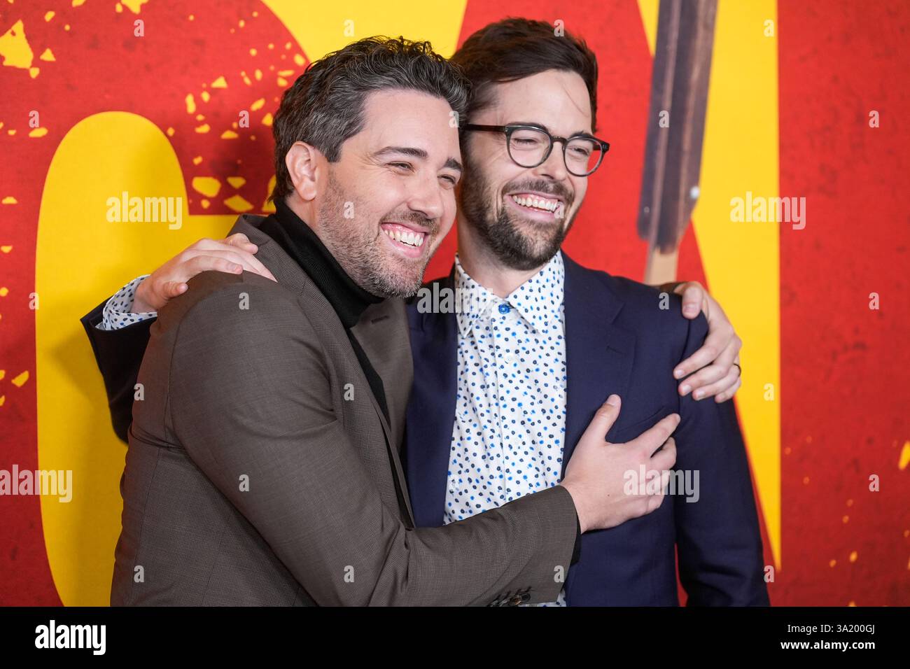 Dan Berk, left, and Robert Olsen arrive at the premiere of "Novocaine ...