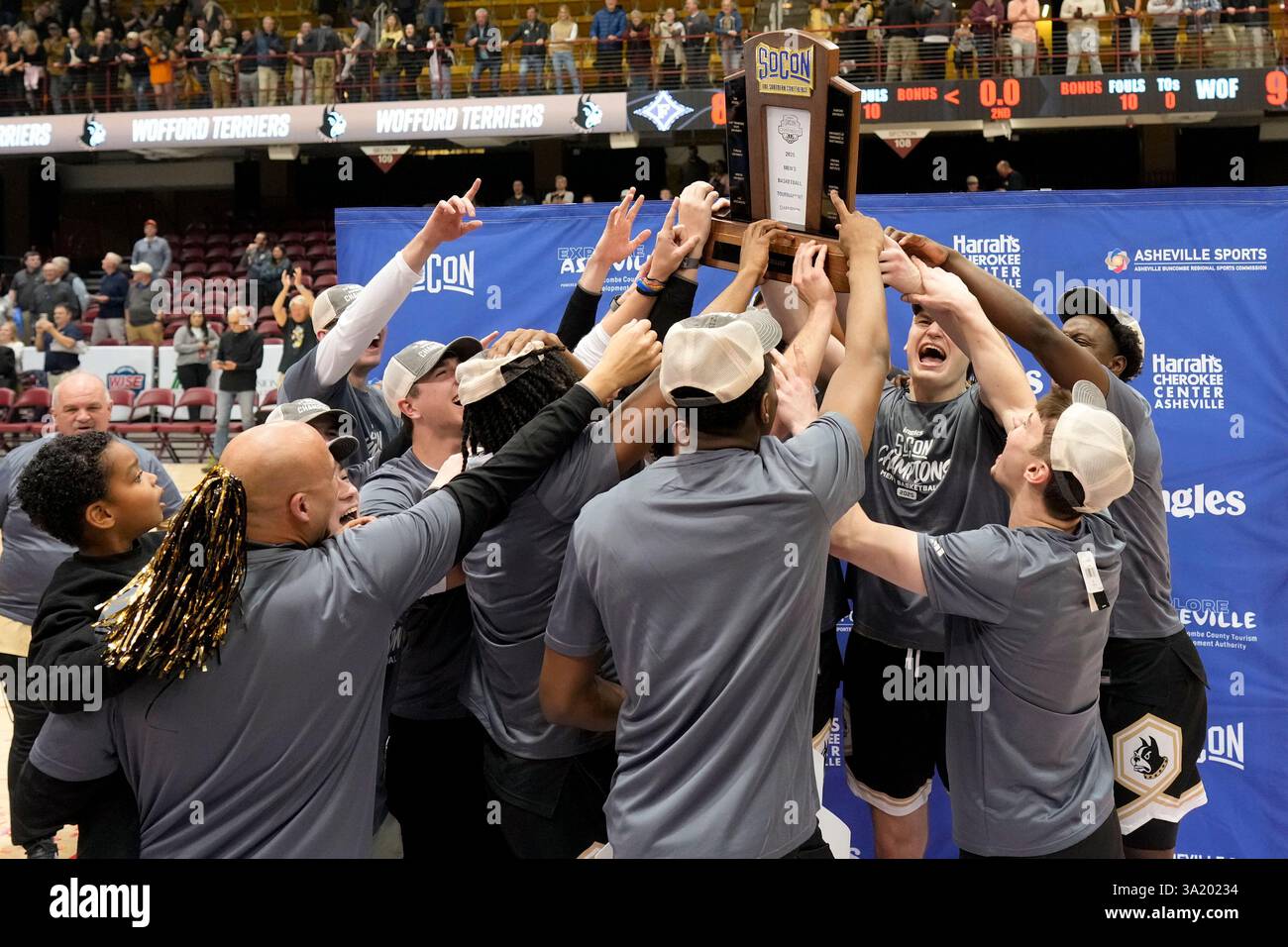 Wofford celebrates with the trophy after their win against Furman in a ...