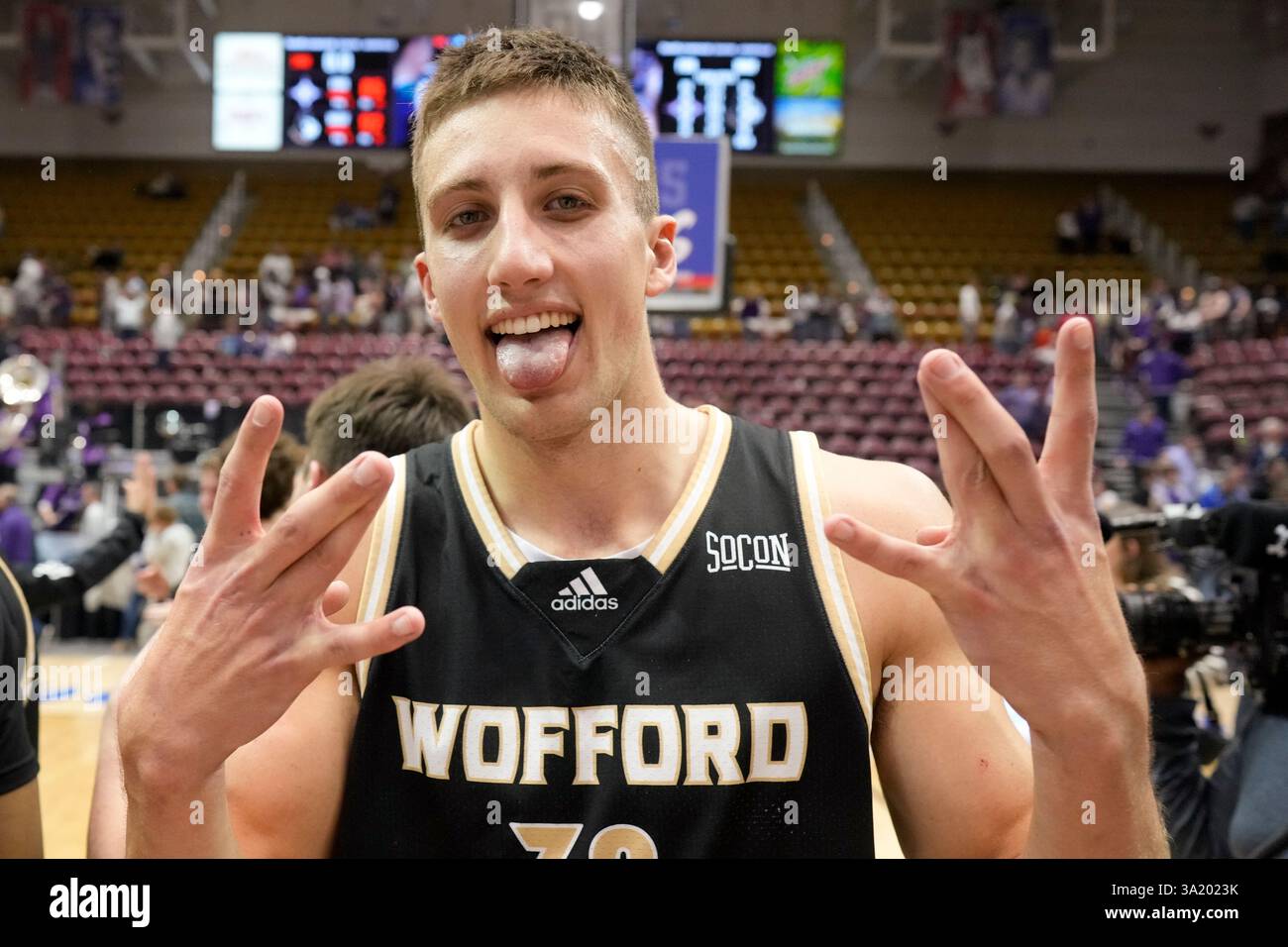 Wofford forward Jeremy Lorenz poses after their win against Furman in a ...