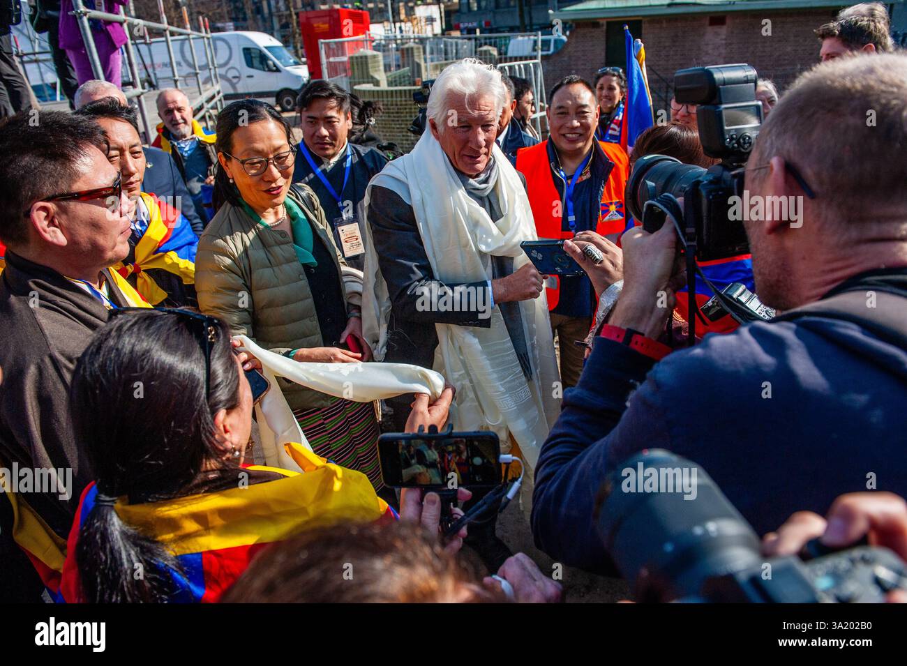 The Hague, Netherlands. 10th Mar, 2025. Media and supporters are seen surrounding Richard Gere ...
