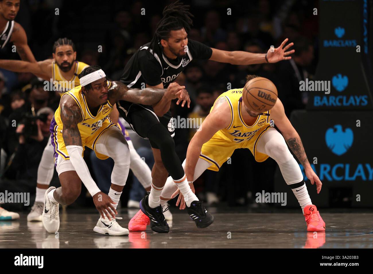 Los Angeles Lakers' Jarred Vanderbilt, front left, and Luka Doncic ...