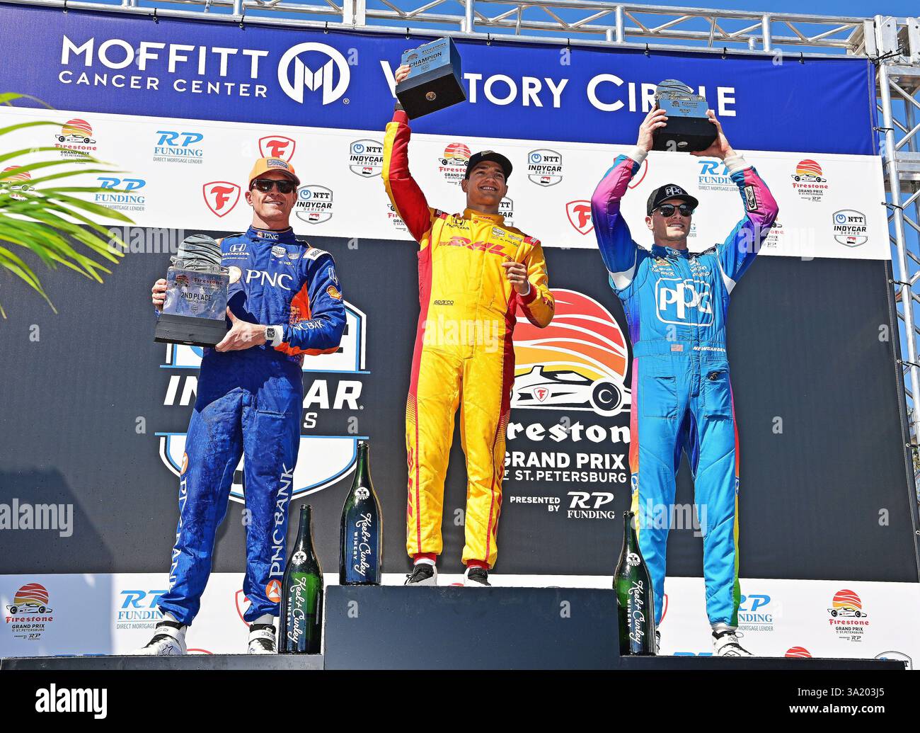 Race winner Alex Palou, second place finisher Scott Dixon and third ...