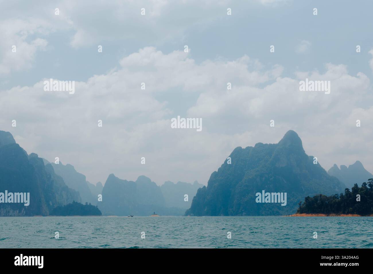 calm waters reflect majestic mountains in a remote location, with ...