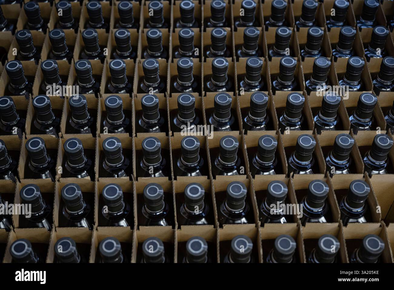 Bottles of product are stored in crates in the bottling area of The ...