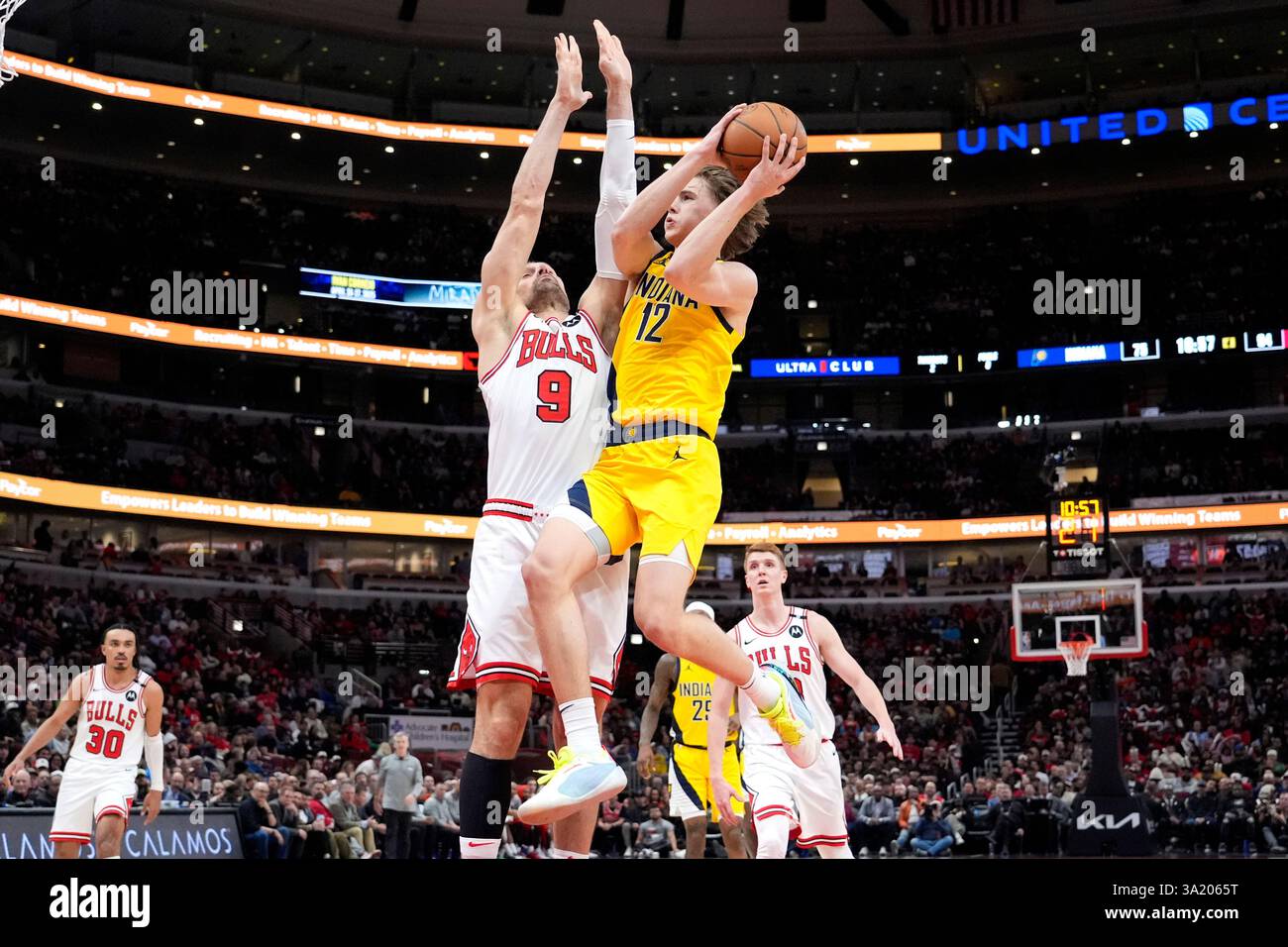Indiana Pacers forward Johnny Furphy, right, drives to the basket ...