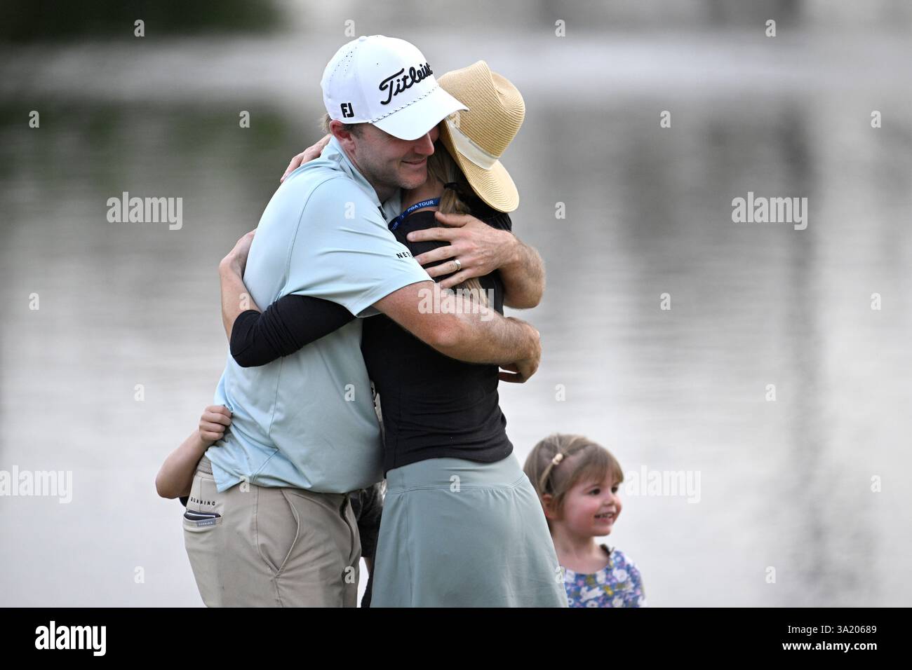 Russell Henley, left, hugs his wife Teil Henley on the 18th green after ...