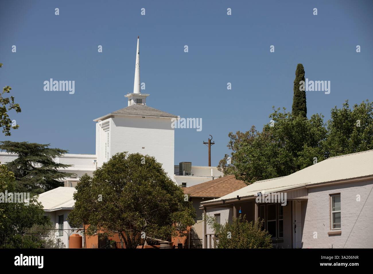 Afternoon sun shines on a historic church and downtown facade of the ...