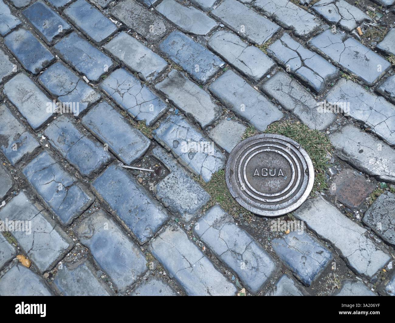A close-up of the historic blue cobblestone streets of Old San Juan ...