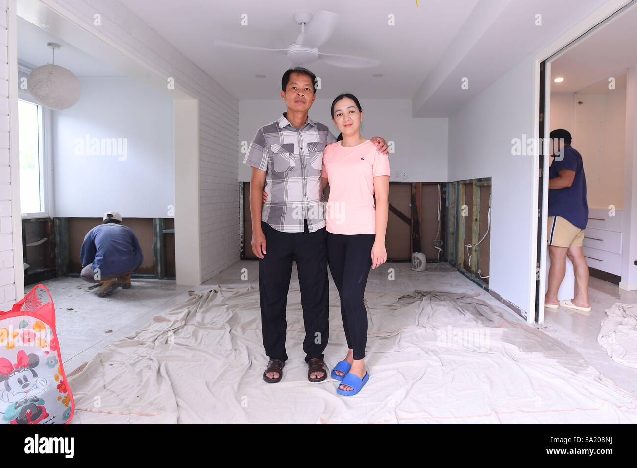 Brisbane, Australia. 11th Mar, 2025. Quang Phan and wife Chu Ma, pose ...