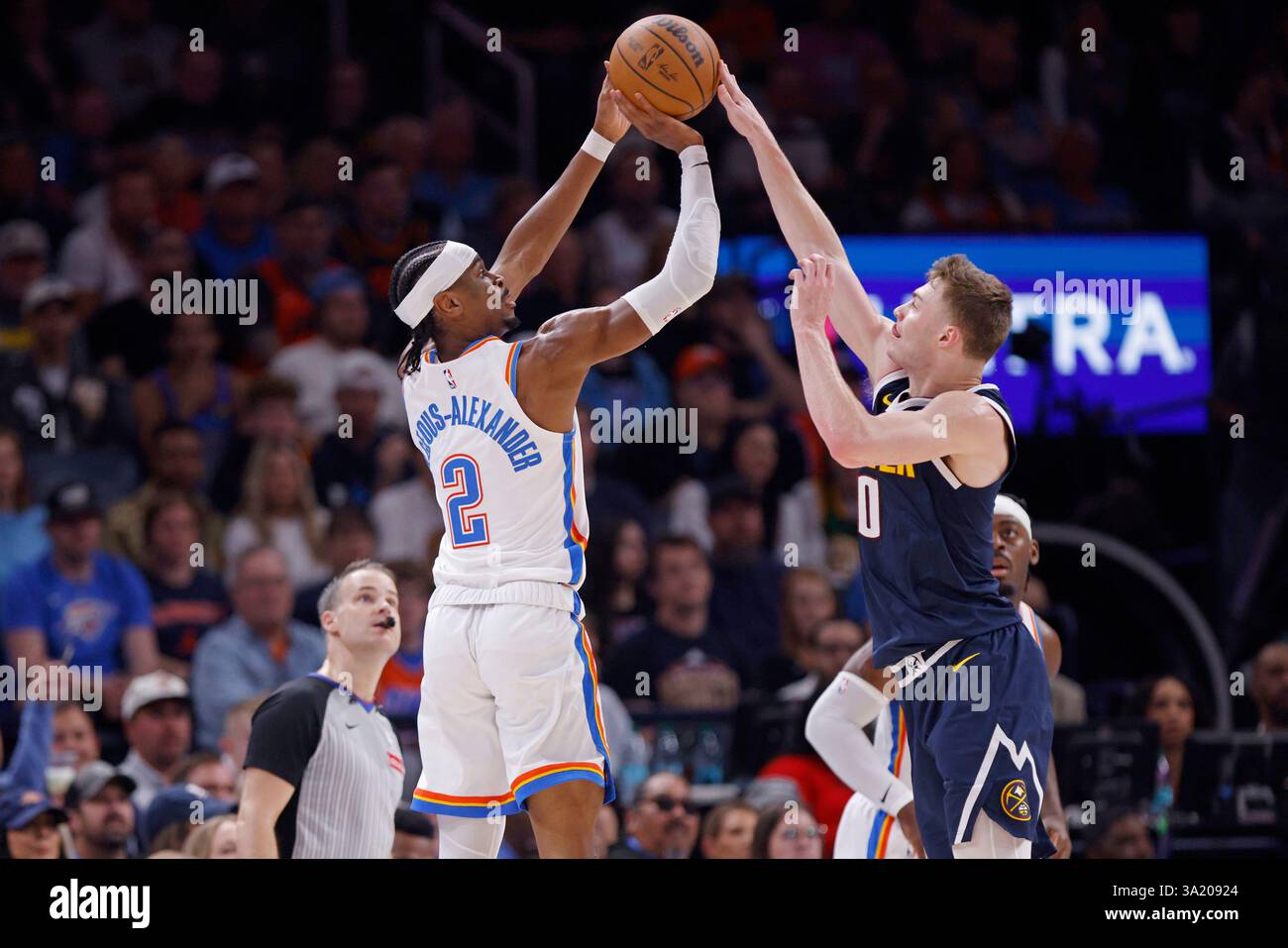 Denver Nuggets guard Christian Braun (0) blocks a shot by Oklahoma City ...