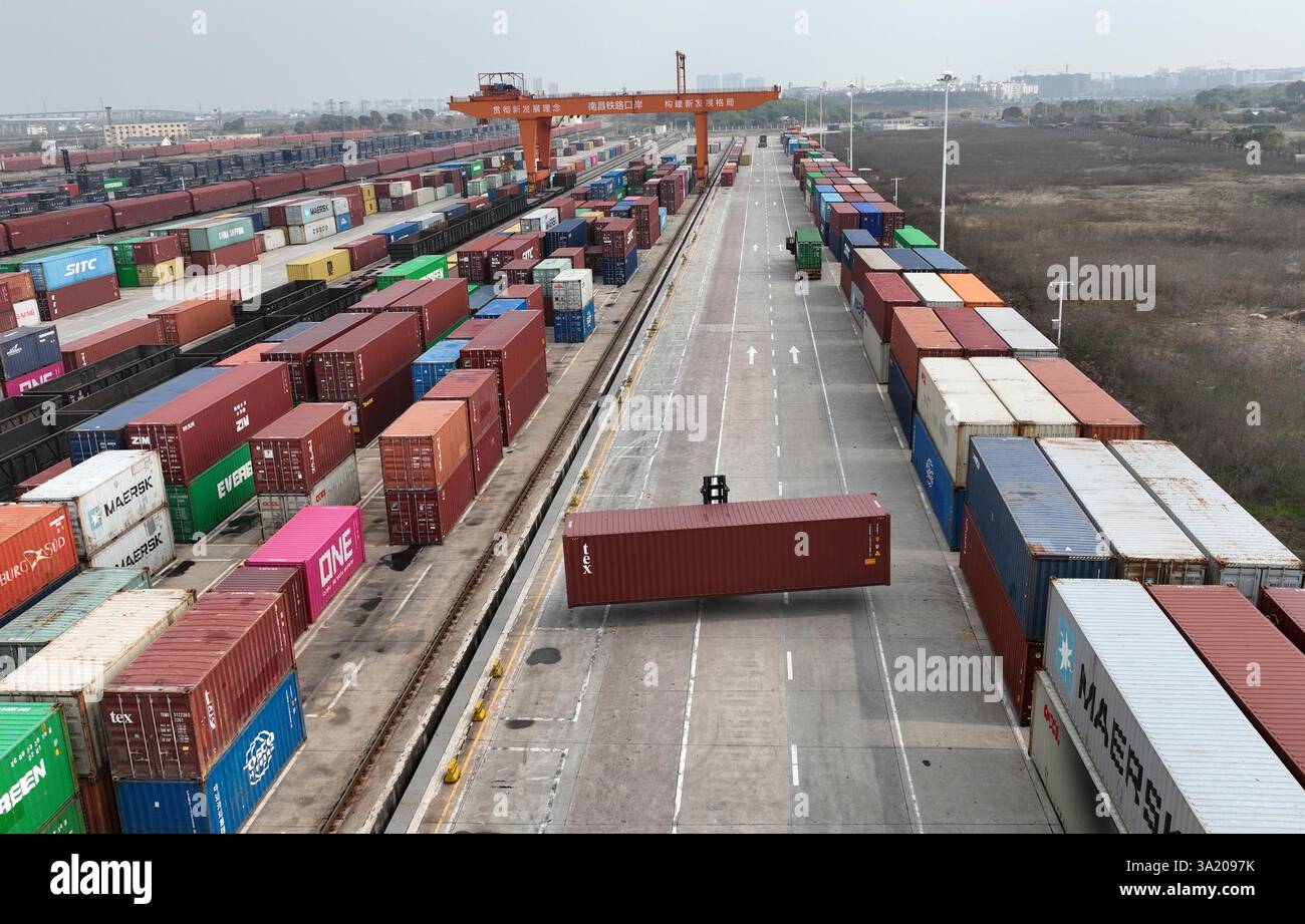 NANCHANG, CHINA - MARCH 6, 2025 - A frontal crane lifts containers at ...