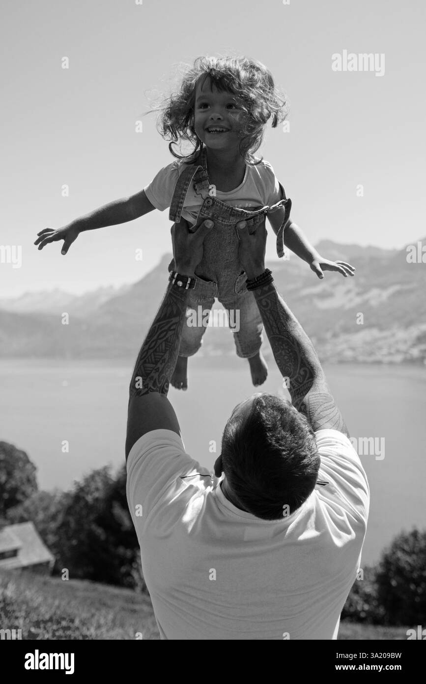 Fathers day. Child in fathers hand. Fathers love. Dad lifting, throwing ...