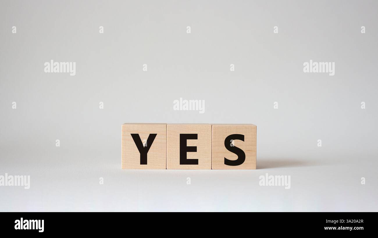 Yes symbol. Wooden blocks with word yes. Beautiful white background ...