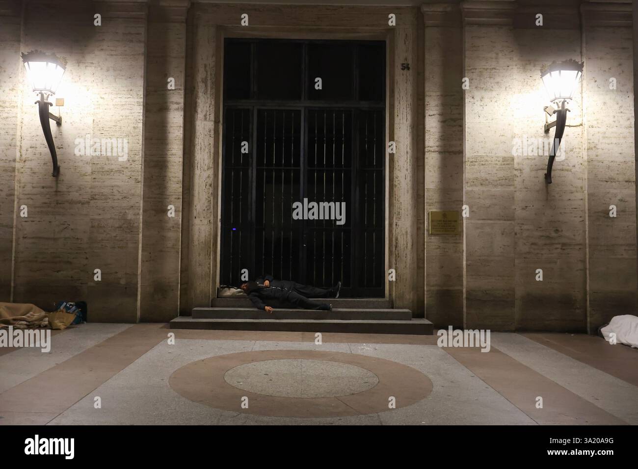 Vatican City, Italy. 08th Mar, 2025. A homeless man sleeps under the ...
