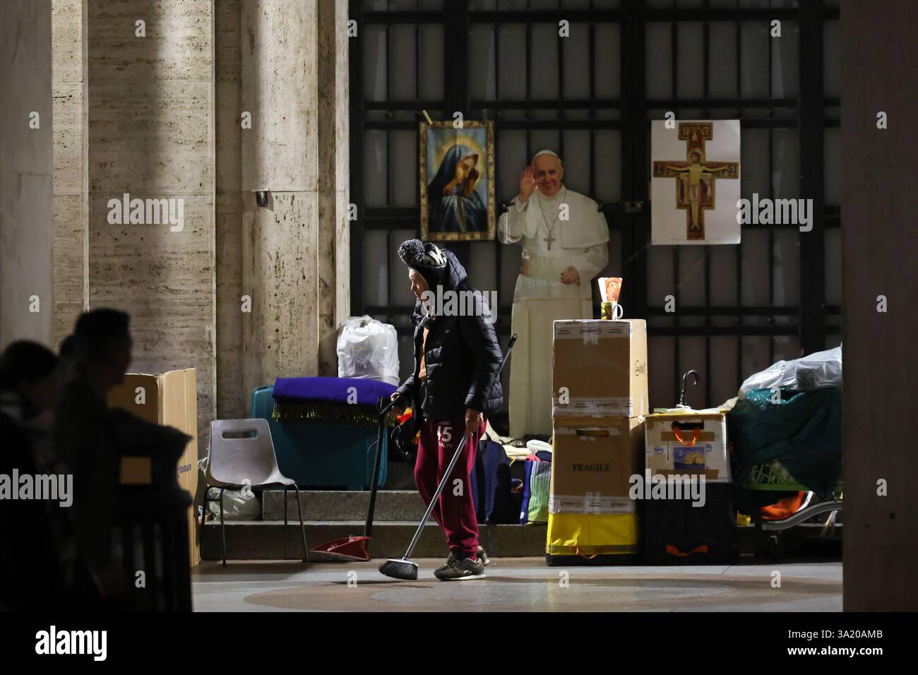 Vatican City, Italy. 08th Mar, 2025. Homeless man cleans the floor ...