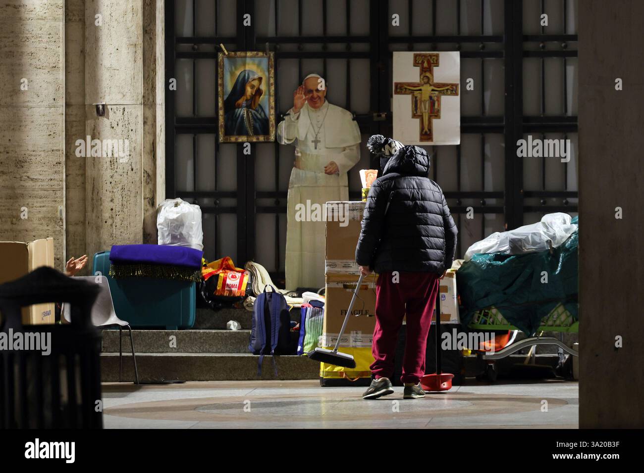 Vatican City, Italy. 08th Mar, 2025. Homeless man cleans the floor ...