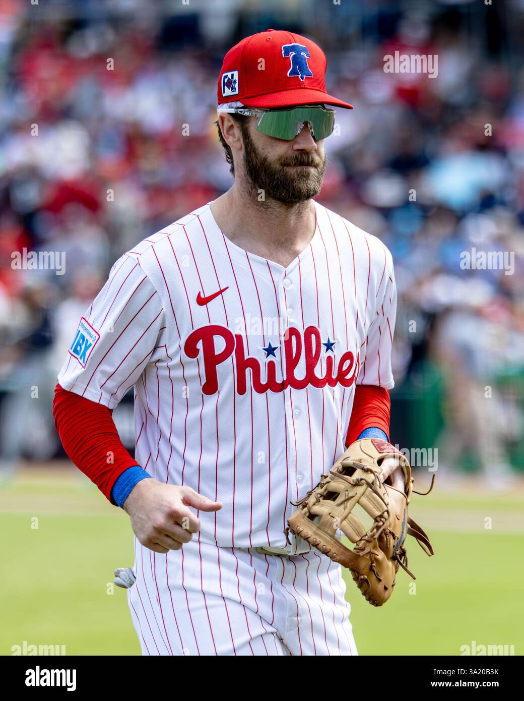 Philadelphia Phillies infielder Bryce Harper returns to the dugout at a ...