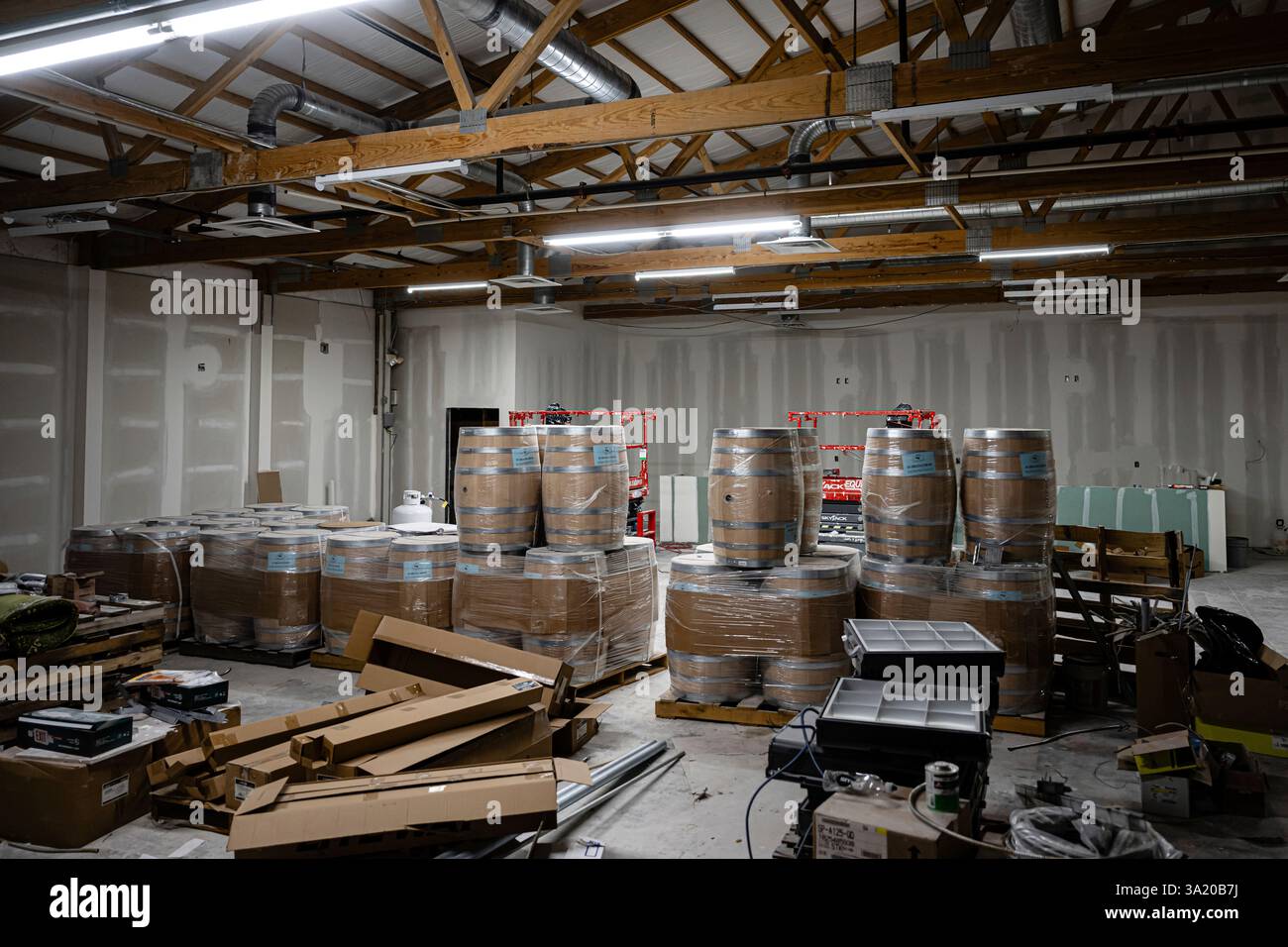 Empty bourbon barrels and construction equipment are seen inside of the ...