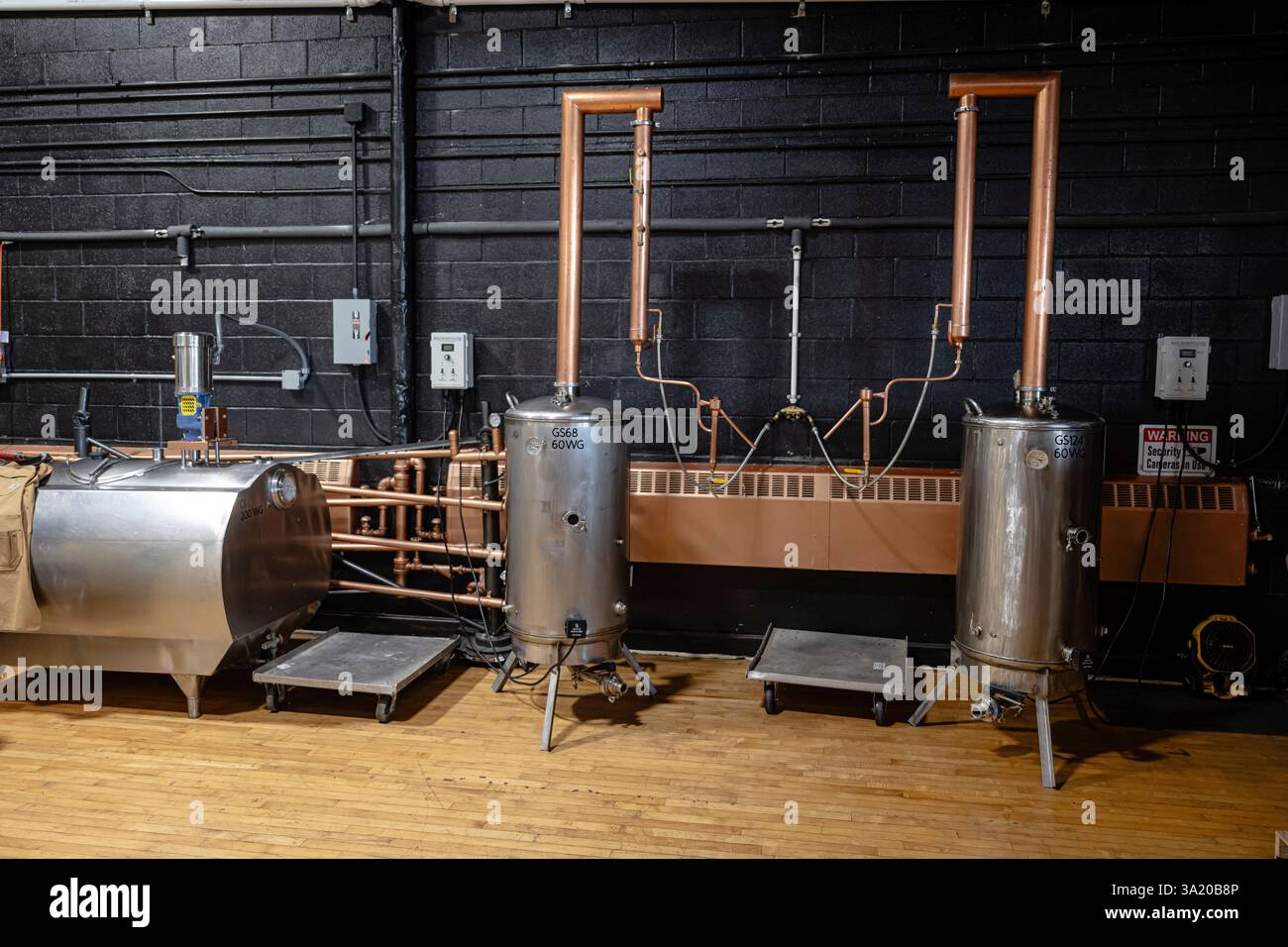 Dual pot stills are seen in the production area at The Bard Distillery ...