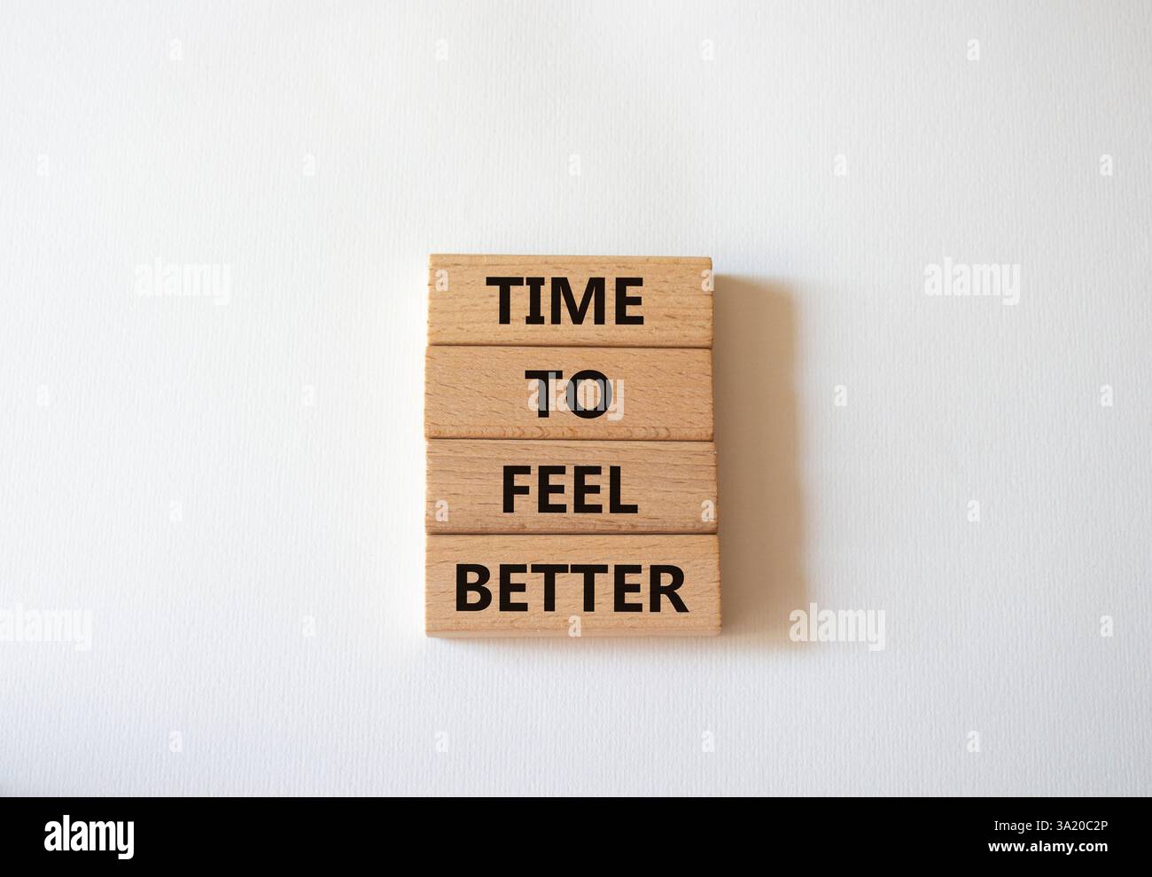 Time to feel better symbol. Wooden blocks with words Time to feel ...