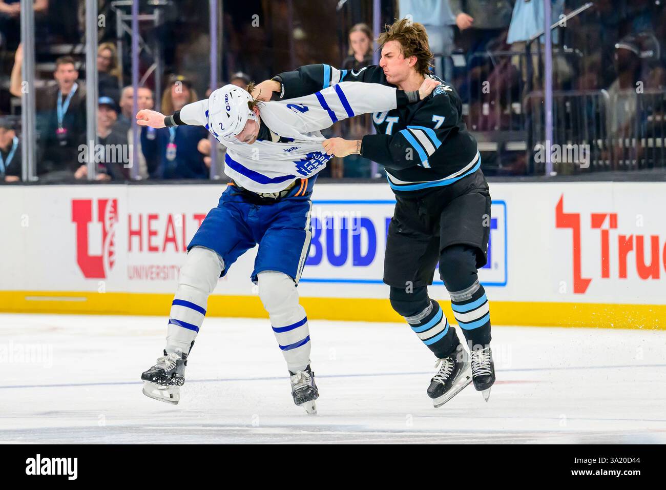 Utah Hockey Club defenseman Michael Kesselring (7) punches Toronto ...