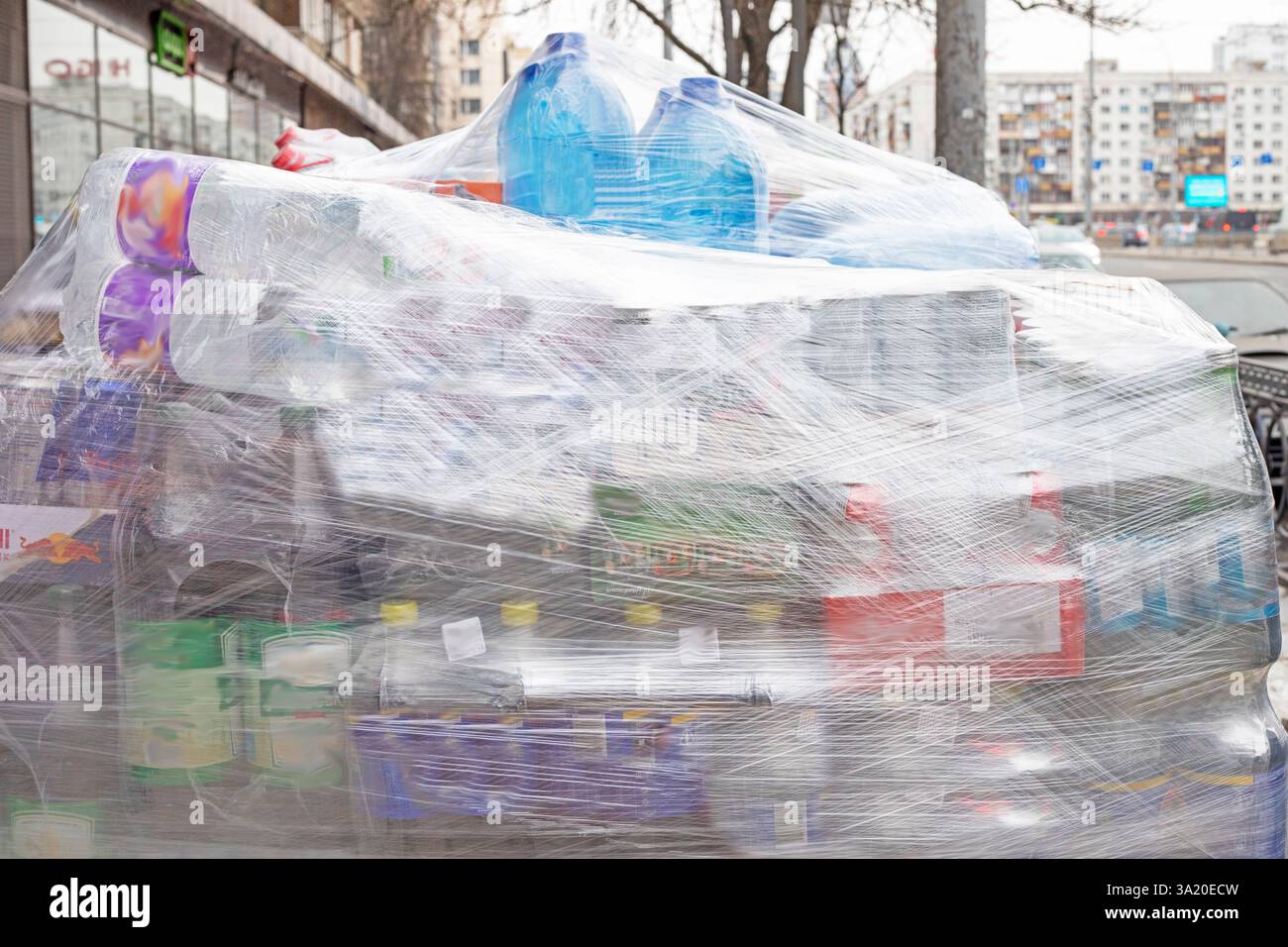 stretch film packaging containers with various drinks for the ...