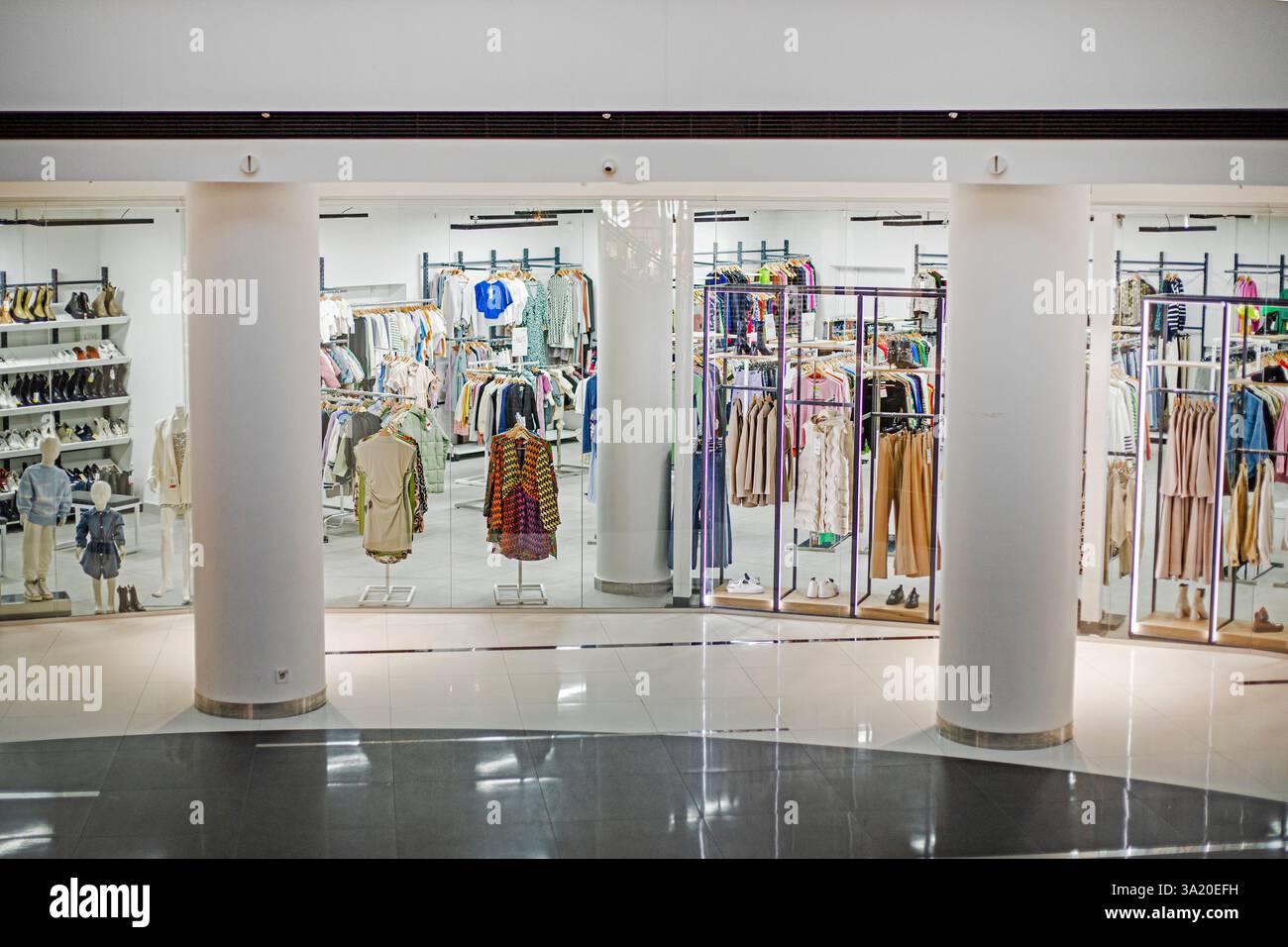 stylish modern clothes for the whole family in the mall Stock Photo - Alamy