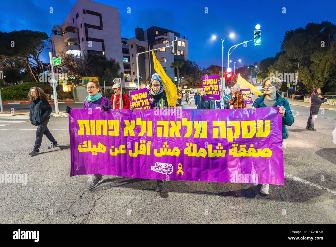 Haifa, Israel - March 08, 2025: People take part in a protest march ...