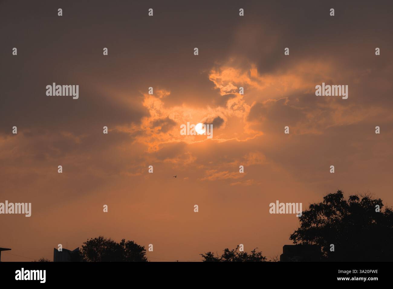 A breathtakingly stunning sunset filled with clouds and radiant rays ...