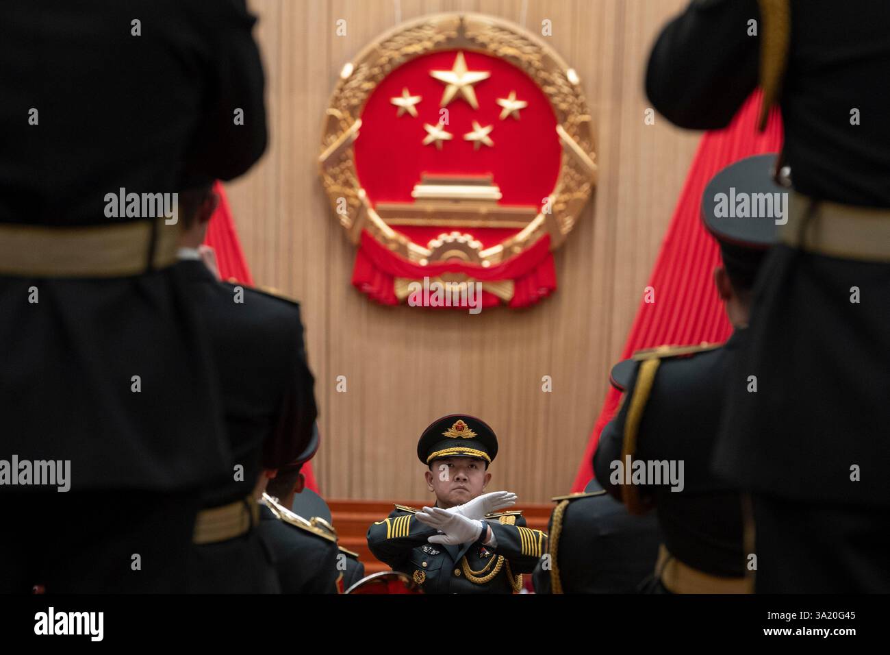 A Chinese military band conductor rehearses before the closing ceremony ...