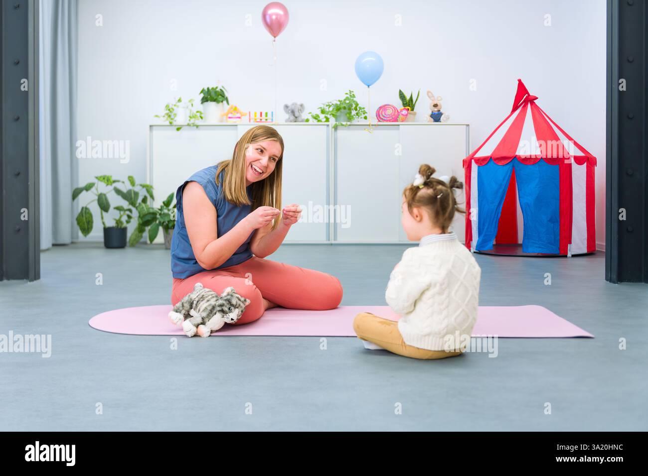 Baby Sign Language. Nonverbal child learning to sign with the help of a ...