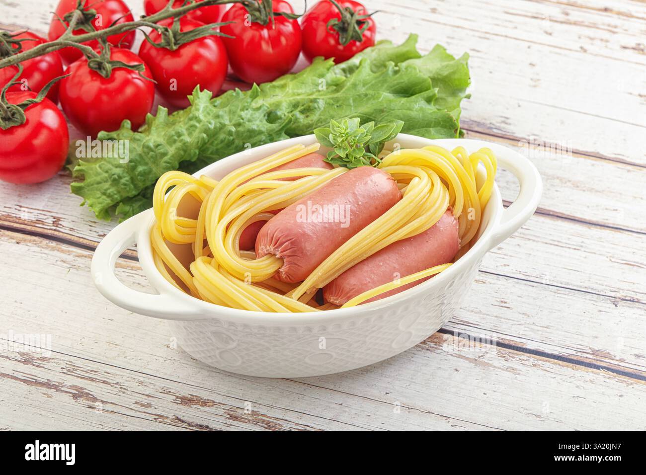 Mini sausages with pasta spaghetti for kids Stock Photo - Alamy
