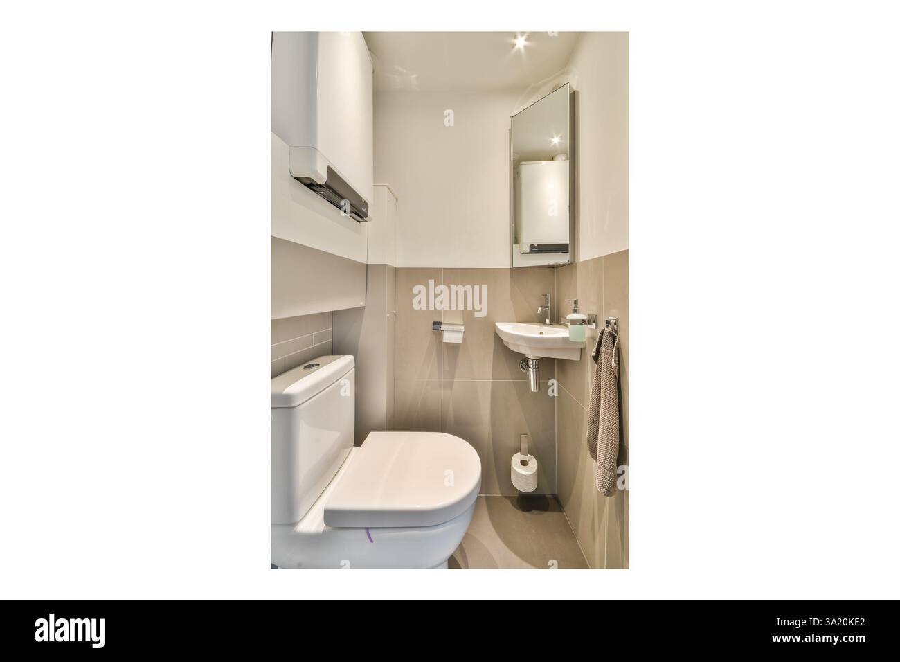 A sleek and minimalist small bathroom featuring a toilet, sink, and ...