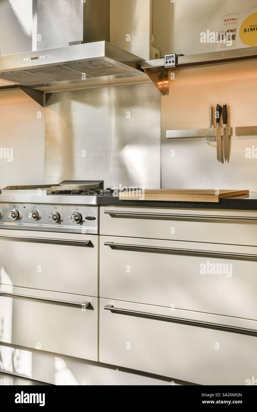 Sleek, contemporary kitchen featuring stainless steel appliances and ...