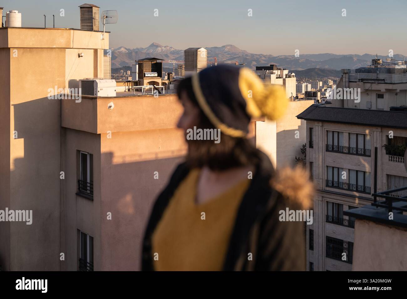 Teheran, Iran. 28th Feb, 2025. An interviewee looks out over the ...