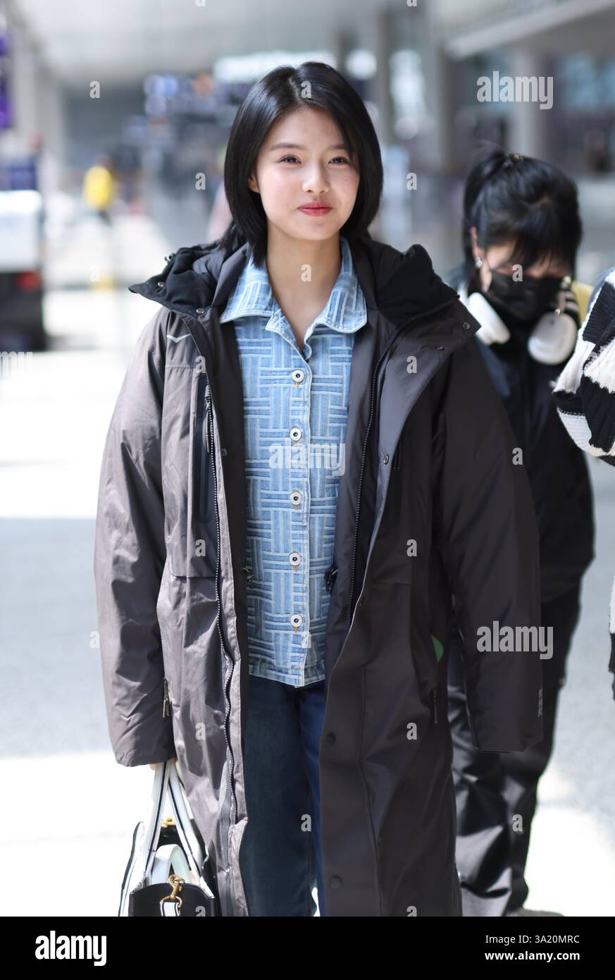 Chinese actress Ai Mi appears at the airport in Shanghai, China, 8 March, 2025 Stock Photo - Alamy