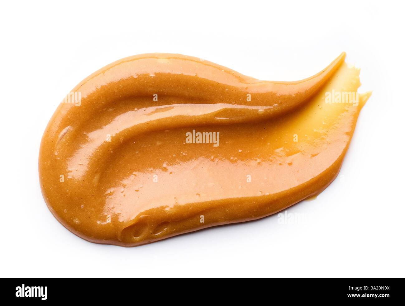 Smear of tasty caramel paste on white background, top view Stock Photo ...