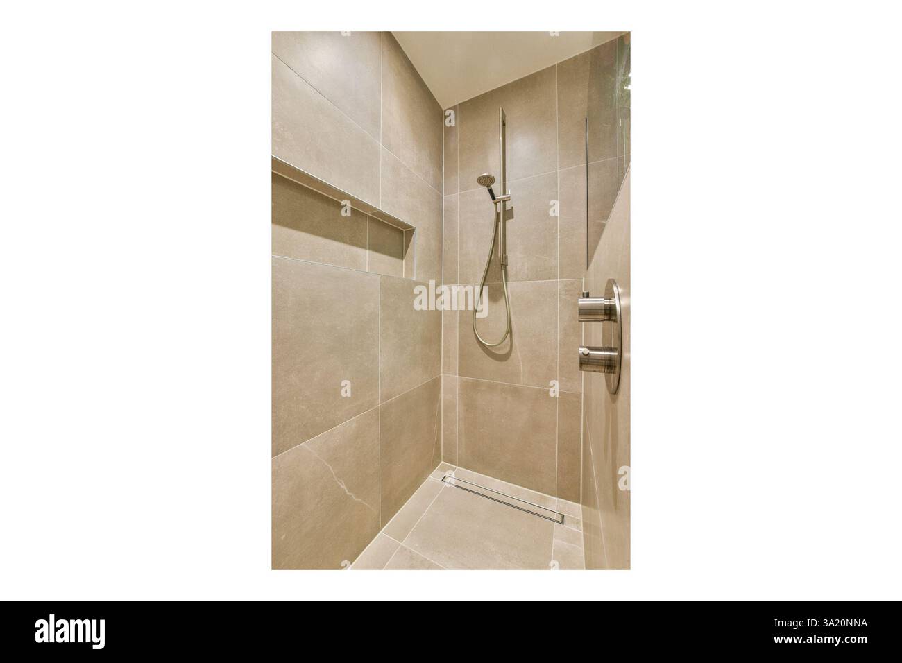 A sleek and stylish shower enclosure featuring contemporary tile ...