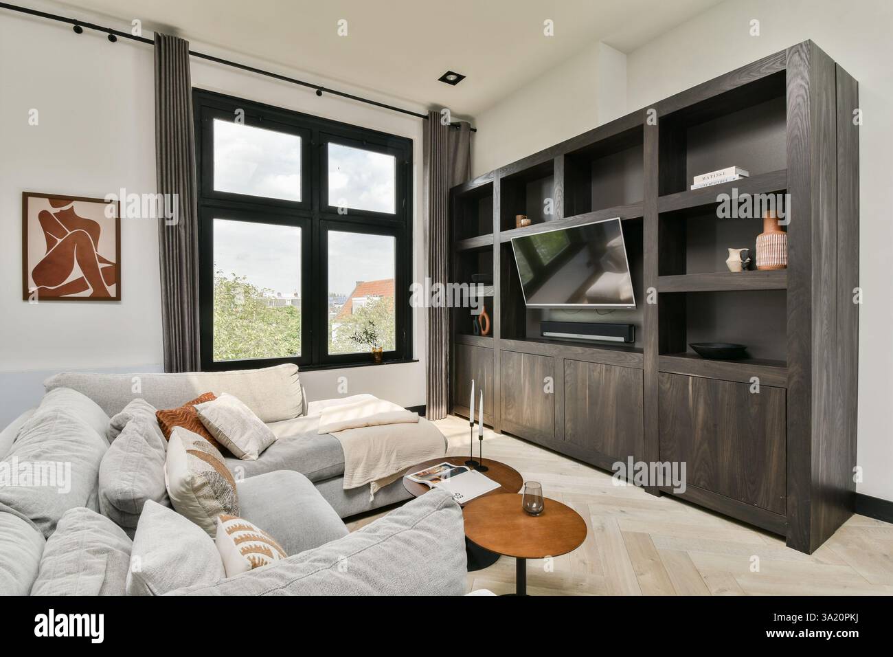 A contemporary living room featuring plush seating, elegant decor, and ...