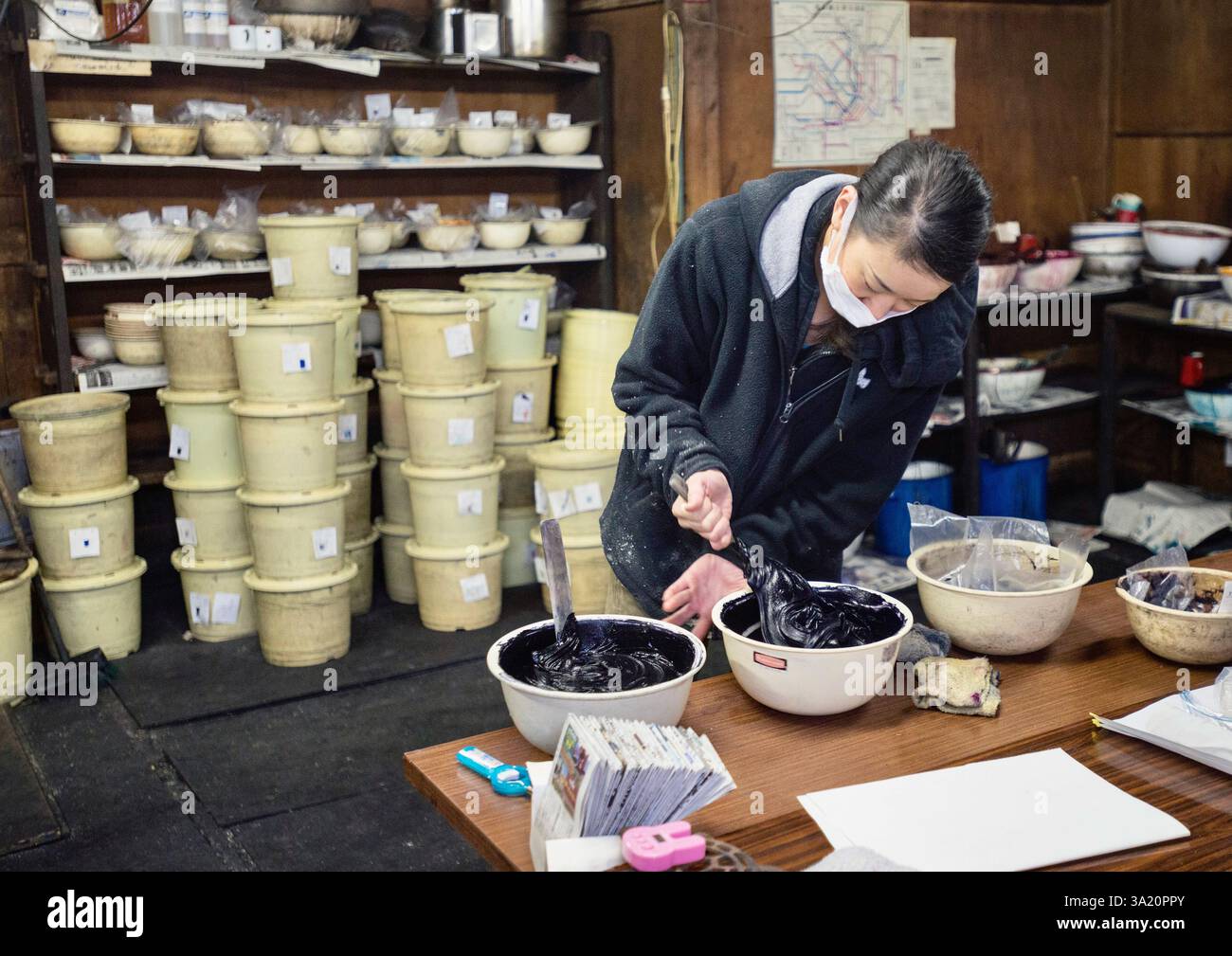 An artisan produce colored dyes for use inthe Tokyo Some Komon fine ...
