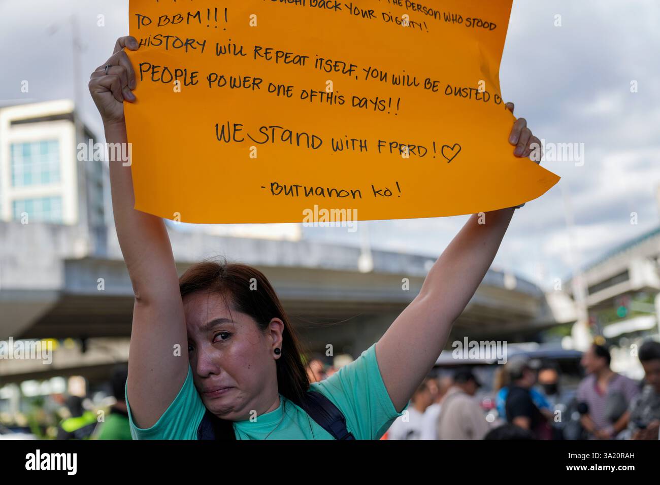 A supporter of former Philippine President Rodrigo Duterte cries as she ...