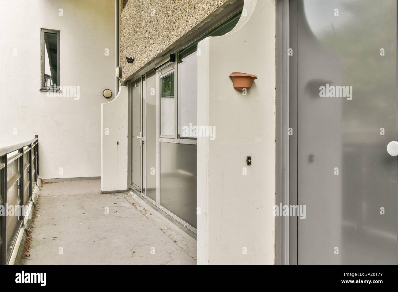 A modern apartment building facade showcasing a blend of textures ...