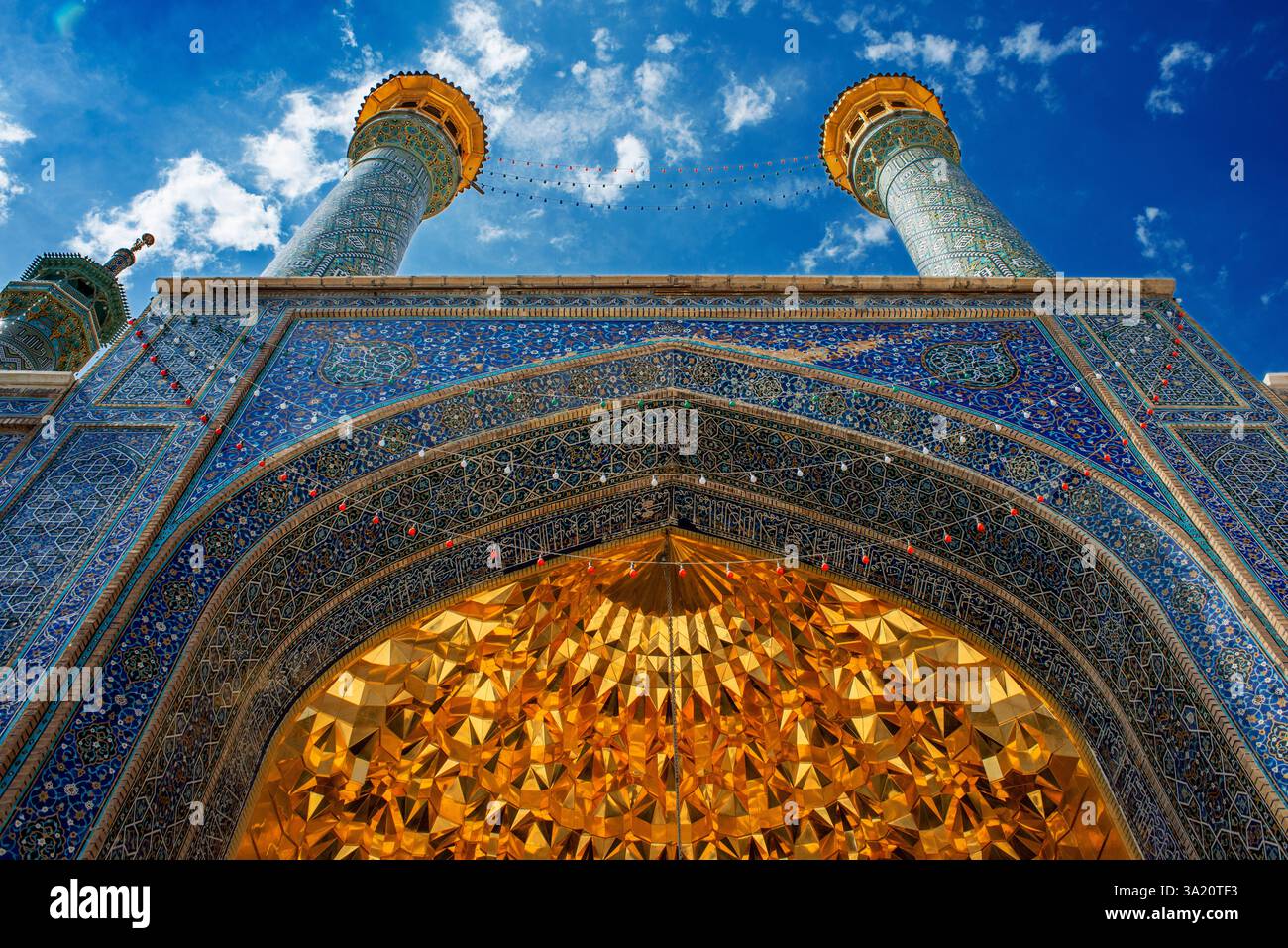 Golden ceiling ornamented minarets of Azam Mosque courtyard, the Shrine of Fatima al-Masumeh ...