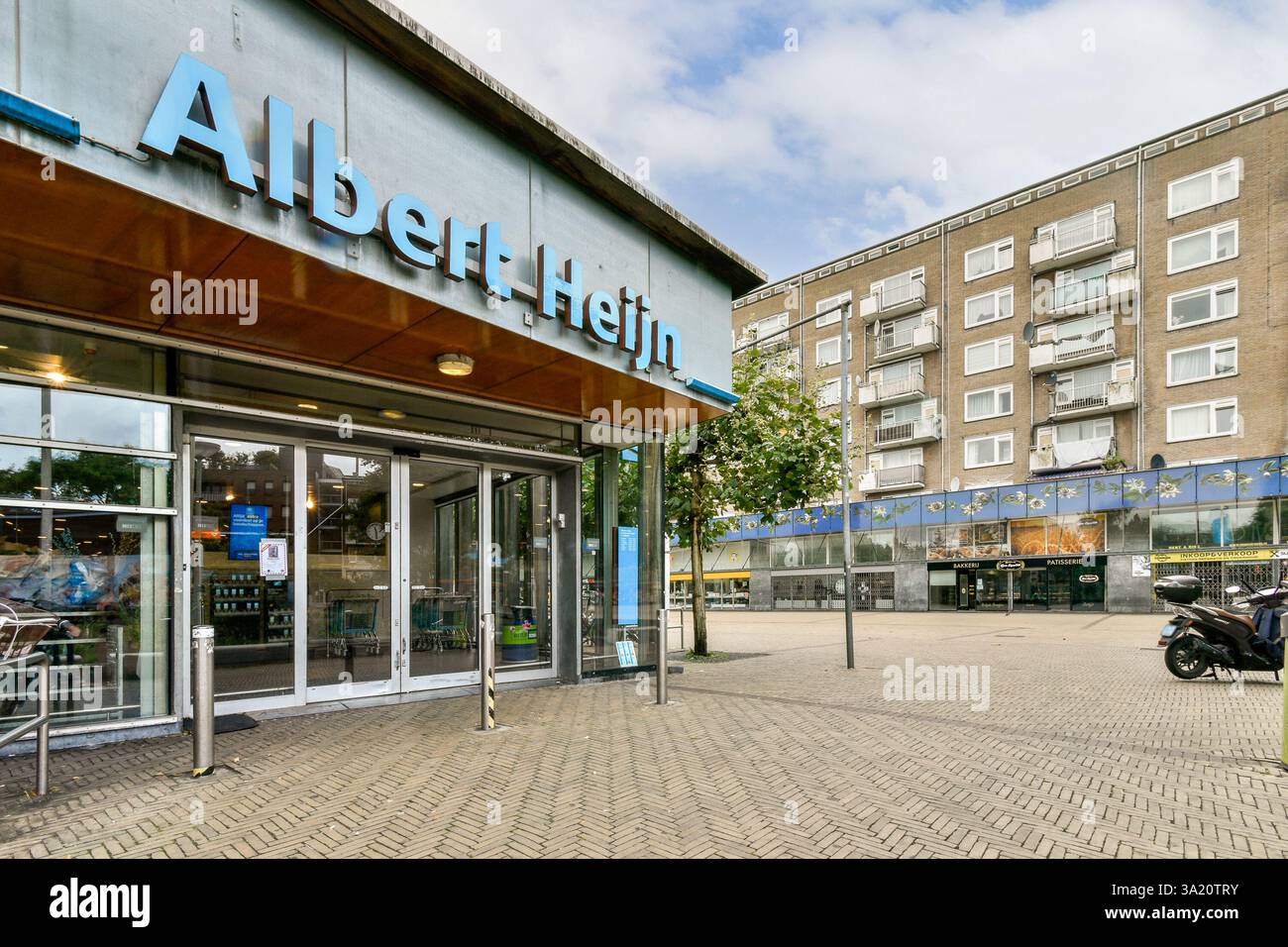 A vibrant urban landscape featuring the storefront of an Albert Heijn ...