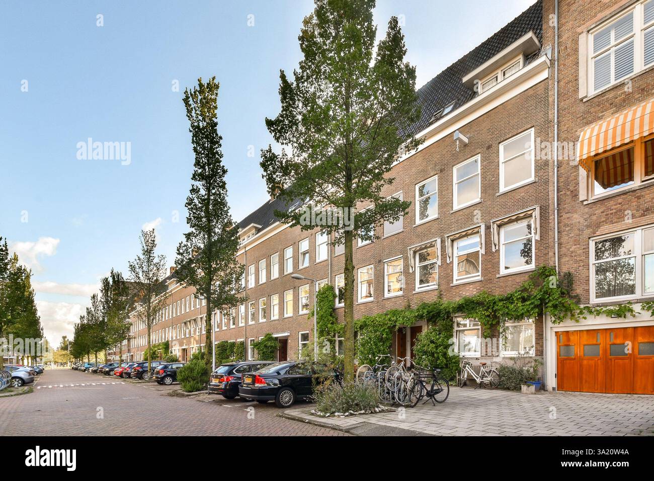 A picturesque urban street showcases modern architectural designs with ...