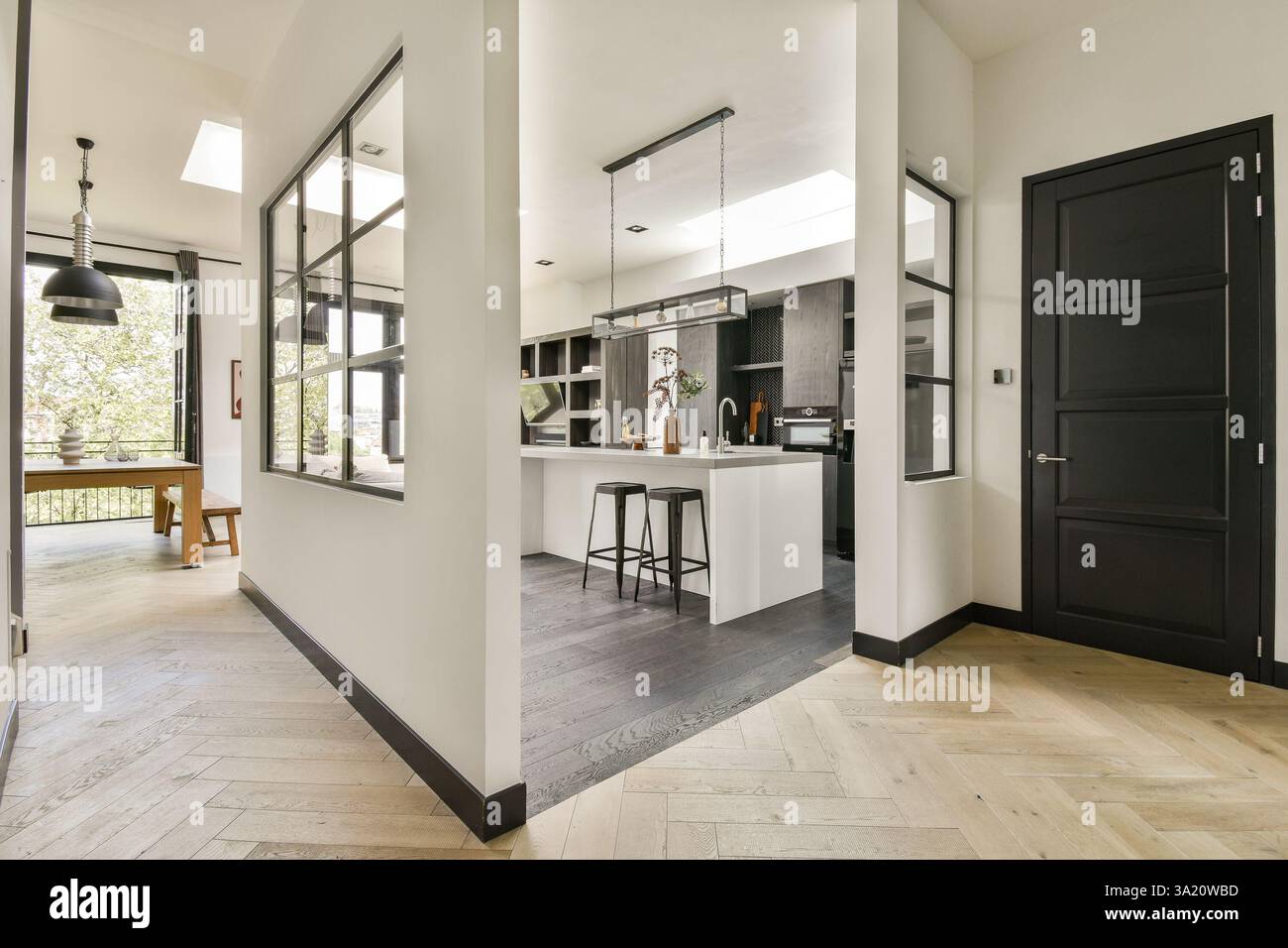 A sleek and contemporary kitchen featuring a minimalist aesthetic with ...