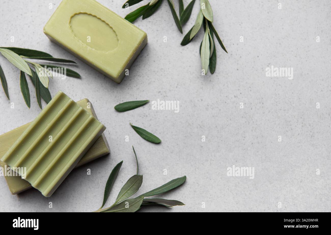 Natural olive soap bars and olive branches creating a relaxing spa ...