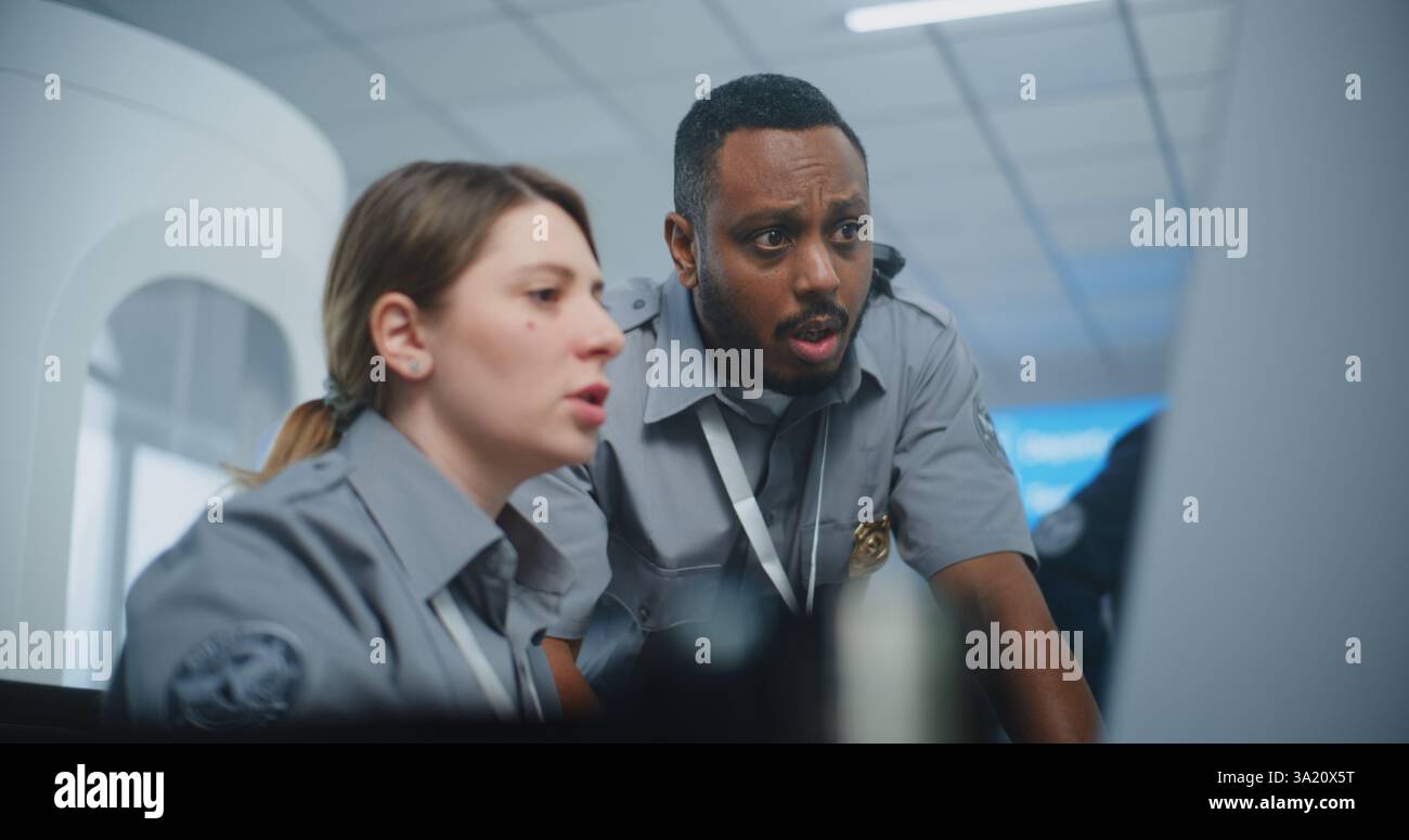 Airport Staff at Security Checkpoint: Two Multiethnic Security Officers ...