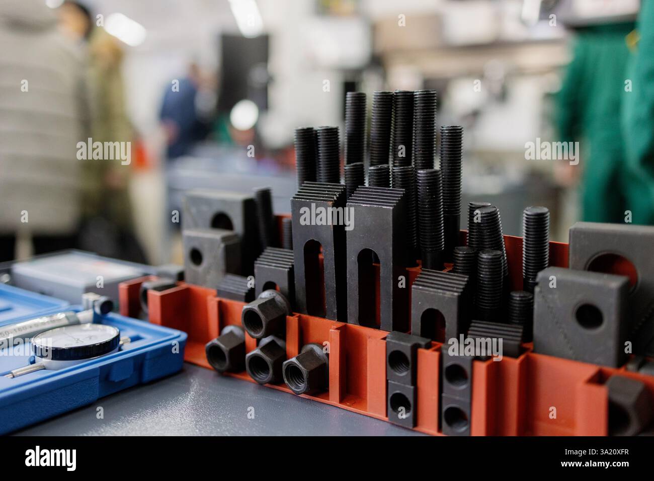 Metal components, including bolts and threads, are meticulously ...