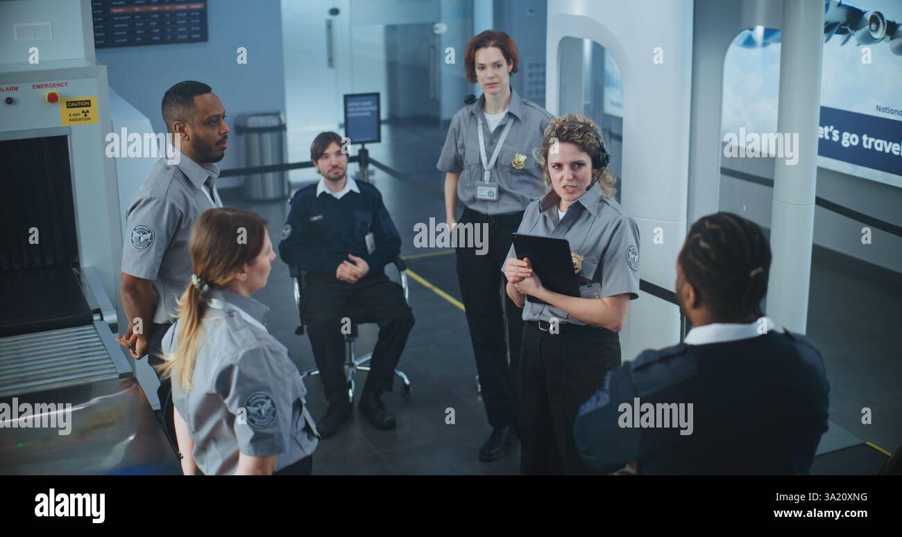 Airport Staff Briefing: Female TSA Officer with Tablet Computer Wearing ...